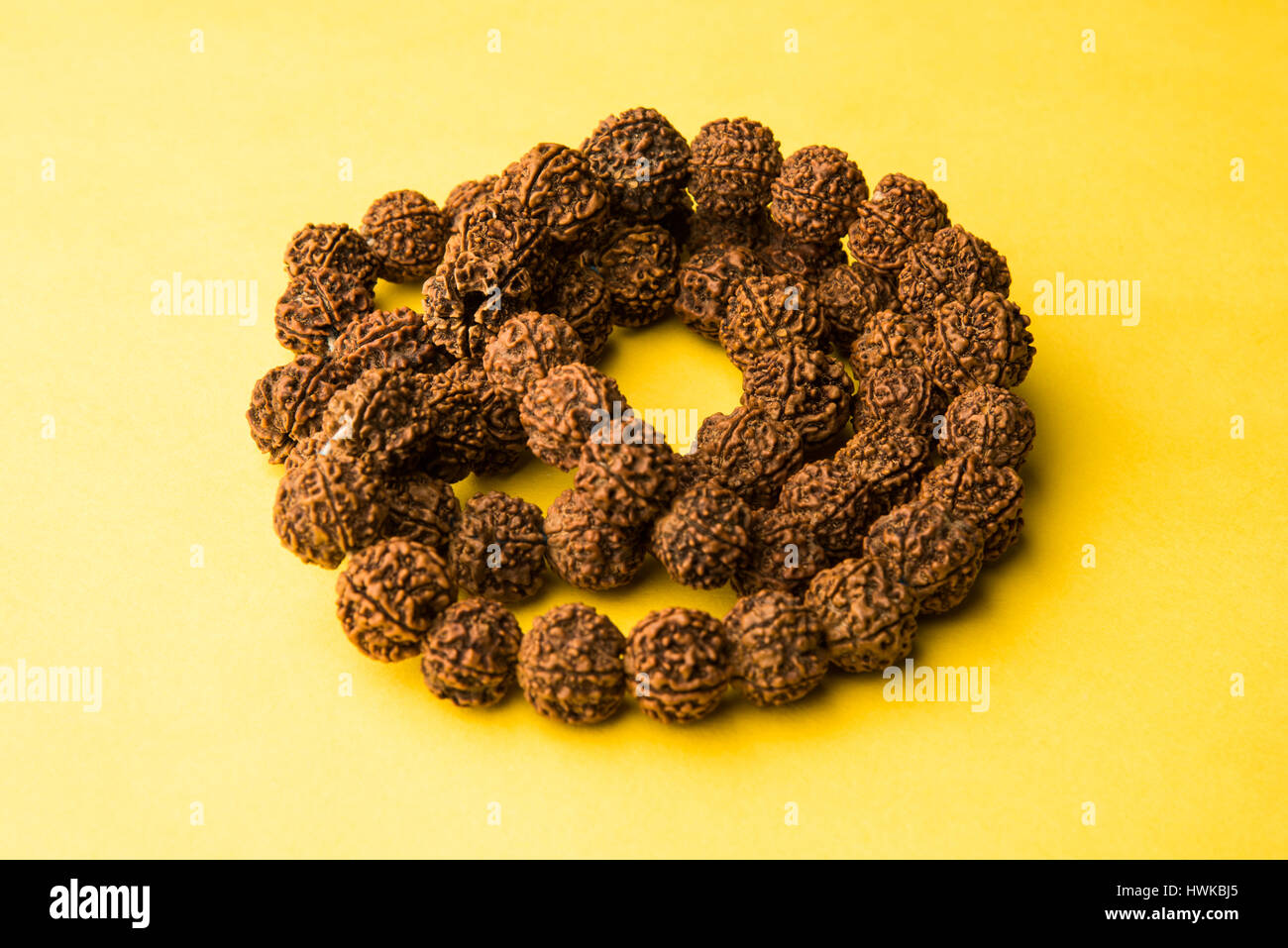 closeup picture of hand while doing Meditation with rudraksha mala or ...