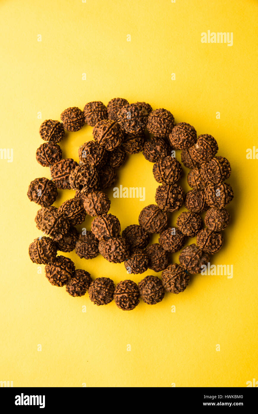 closeup picture of hand while doing Meditation with rudraksha mala or ...