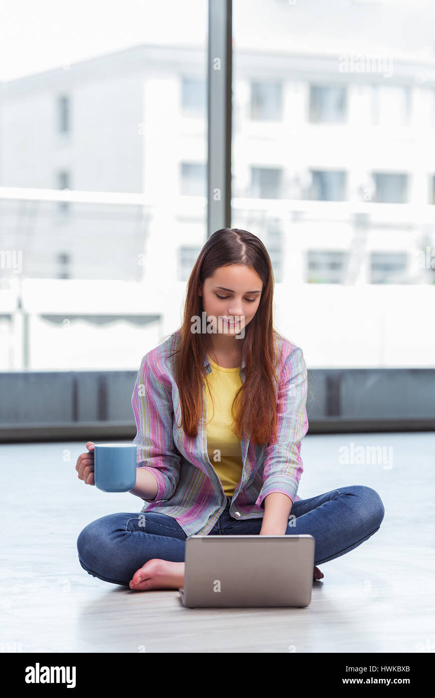 Young girl surfing internet on laptop Stock Photo - Alamy