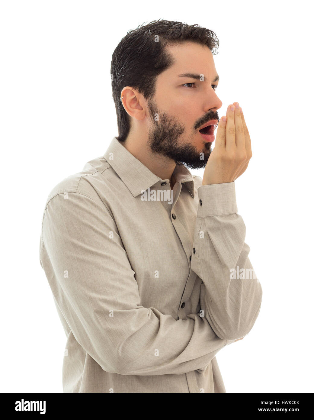 Checking the breath, man in social clothes. Isolated on white ...
