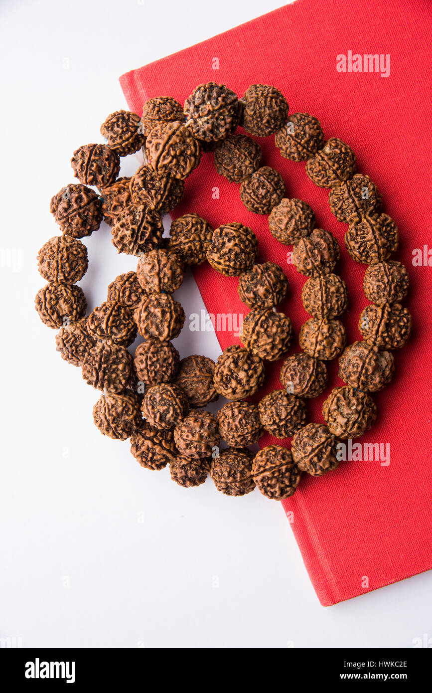 closeup picture of hand while doing Meditation with rudraksha mala or ...
