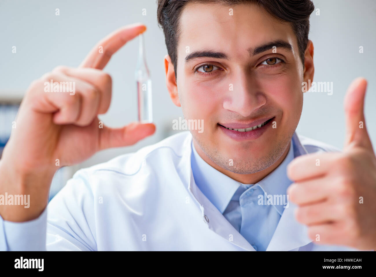 Doctor holding medicines in the lab Stock Photo - Alamy