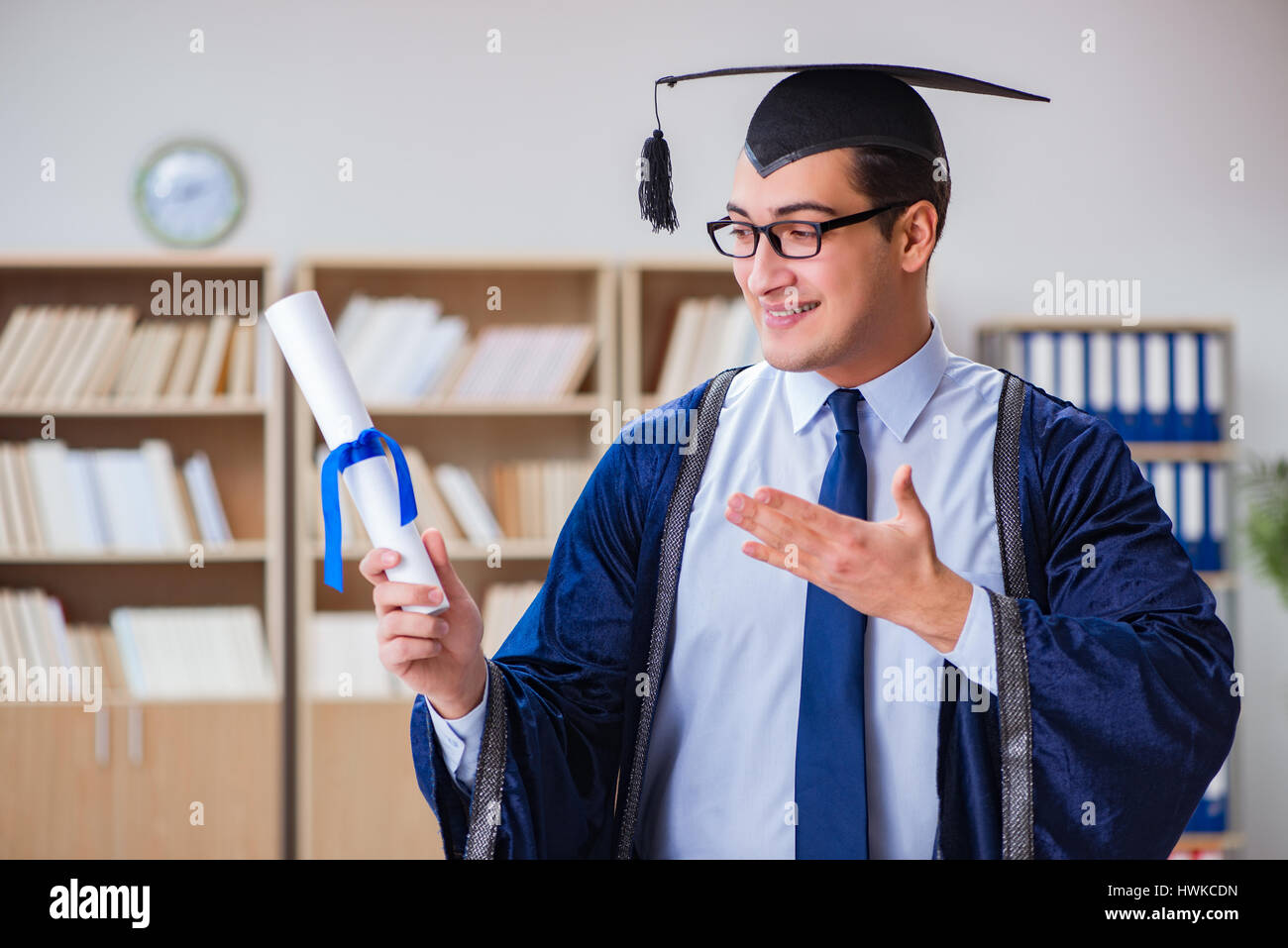Young man graduating from university Stock Photo - Alamy