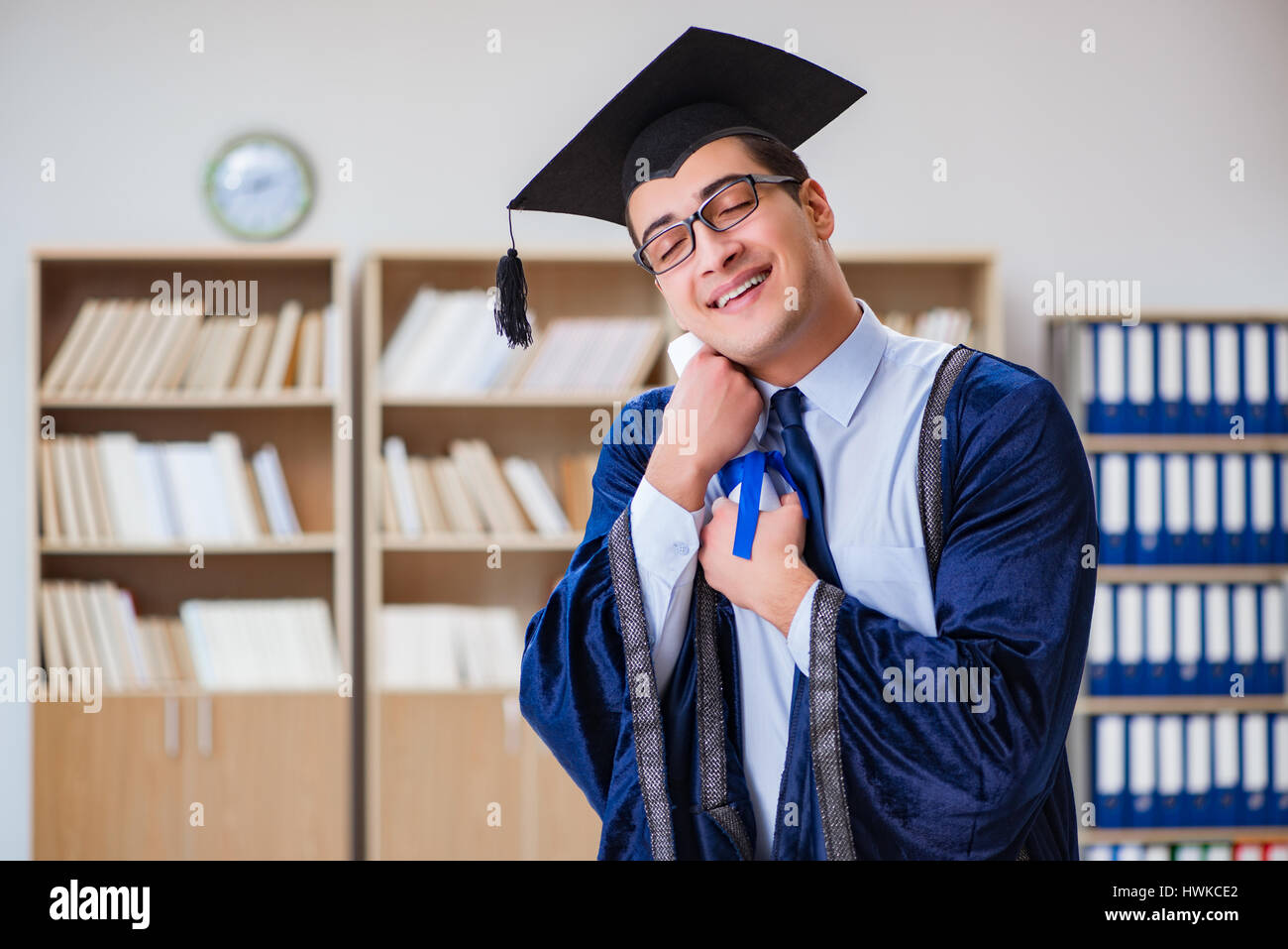 Young man graduating from university Stock Photo - Alamy
