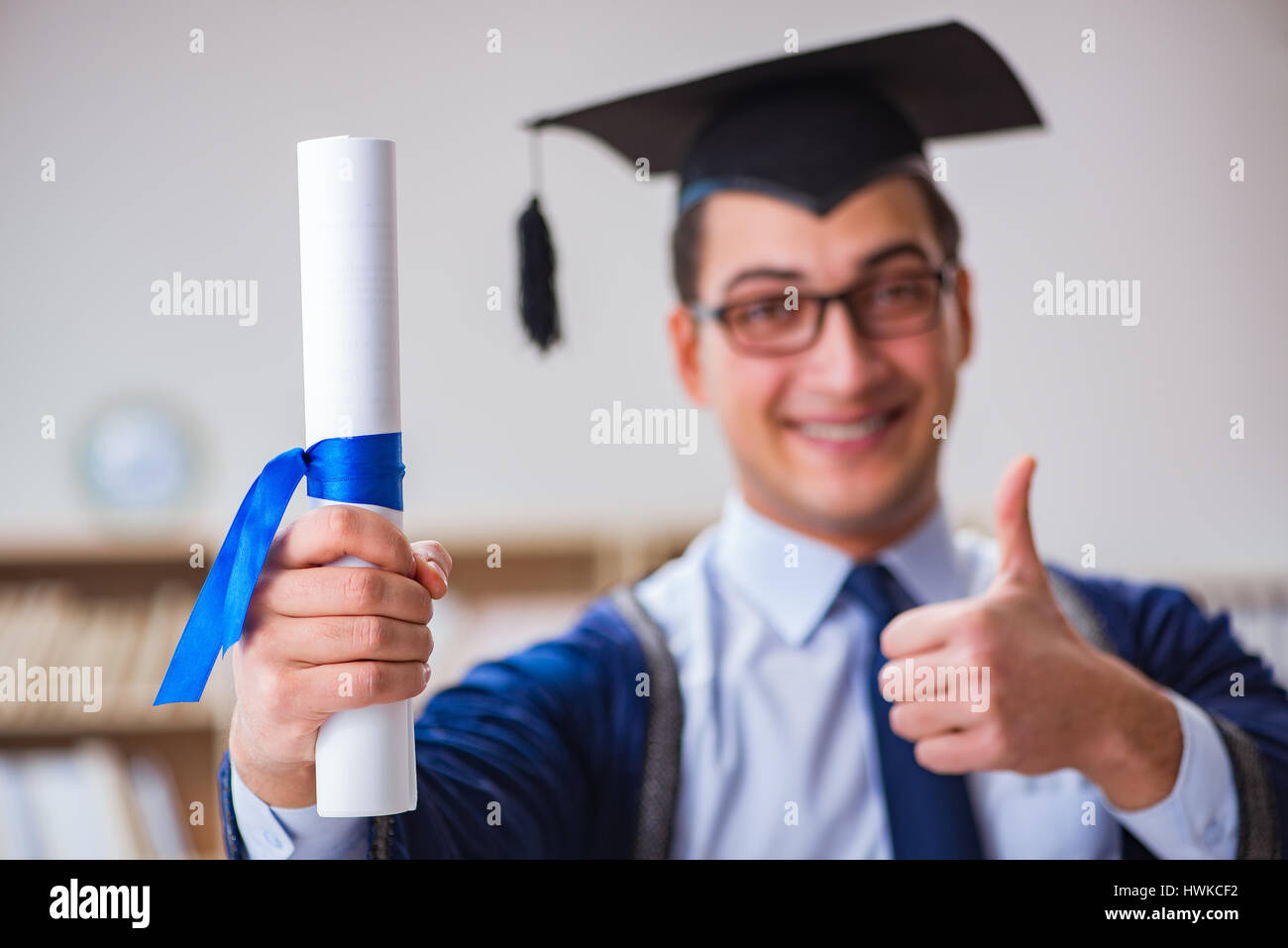 Young man graduating from university Stock Photo - Alamy