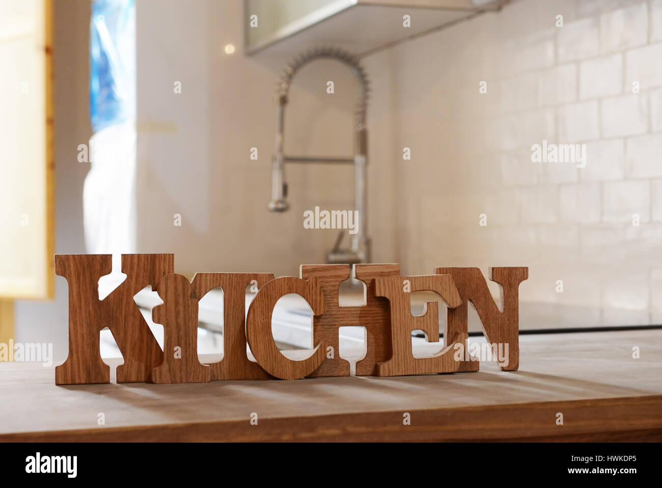 Word kitchen made from wooden letters on the wooden table in the ...