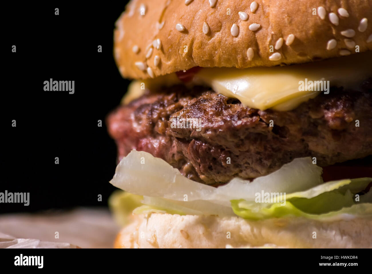 Burger close-up on black background Stock Photo - Alamy