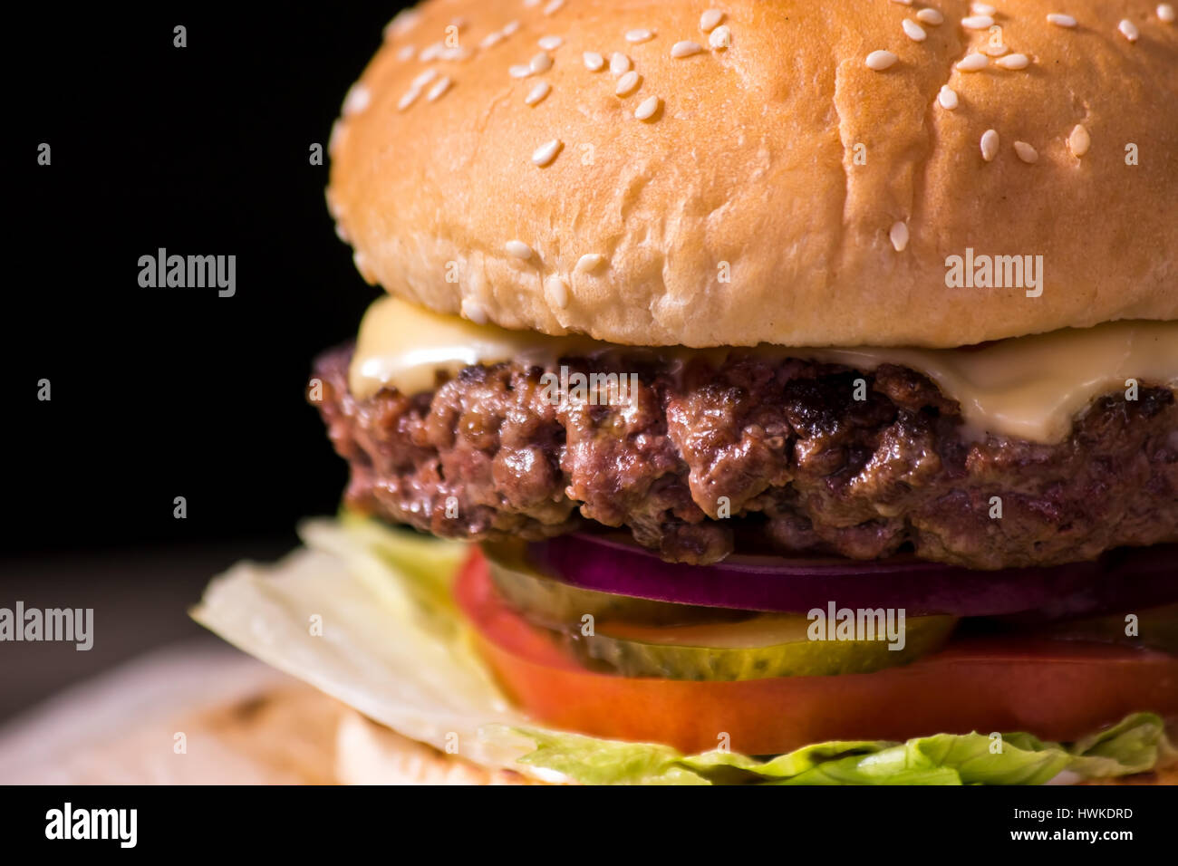 Hamburger on black background Stock Photo - Alamy