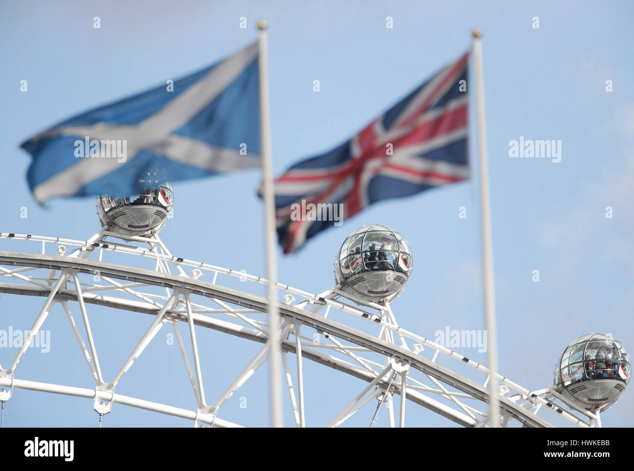 A Saltire flag and a Union flag flying above the London Eye in ...
