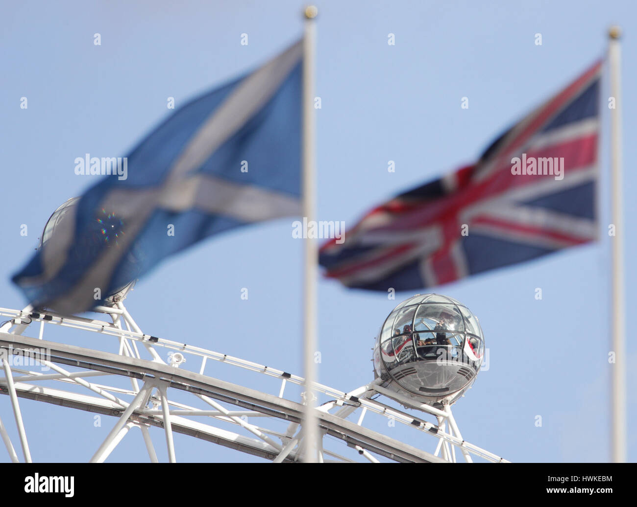 A Saltire flag and a Union flags flying above the London Eye in ...