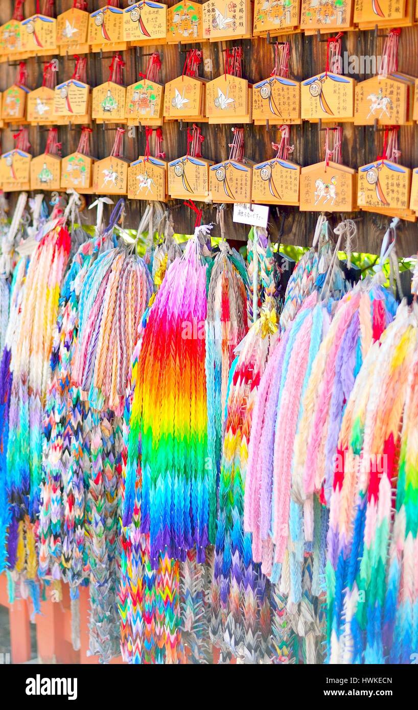 Ema prayer tablets and strings of paper origami cranes. Wishes written ...