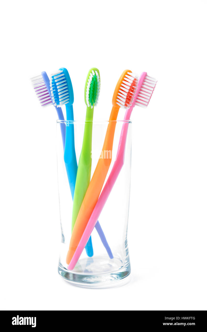 colorful toothbrushes in glass Stock Photo - Alamy