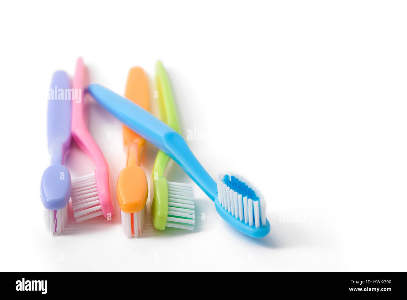 colorful toothbrushes on white background Stock Photo - Alamy