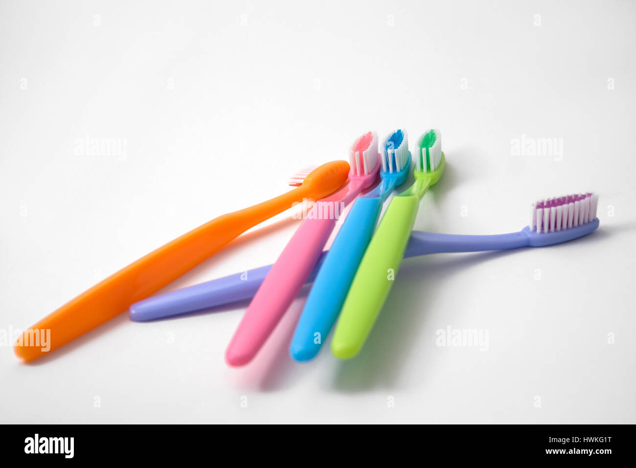 colorful toothbrushes on white background Stock Photo - Alamy