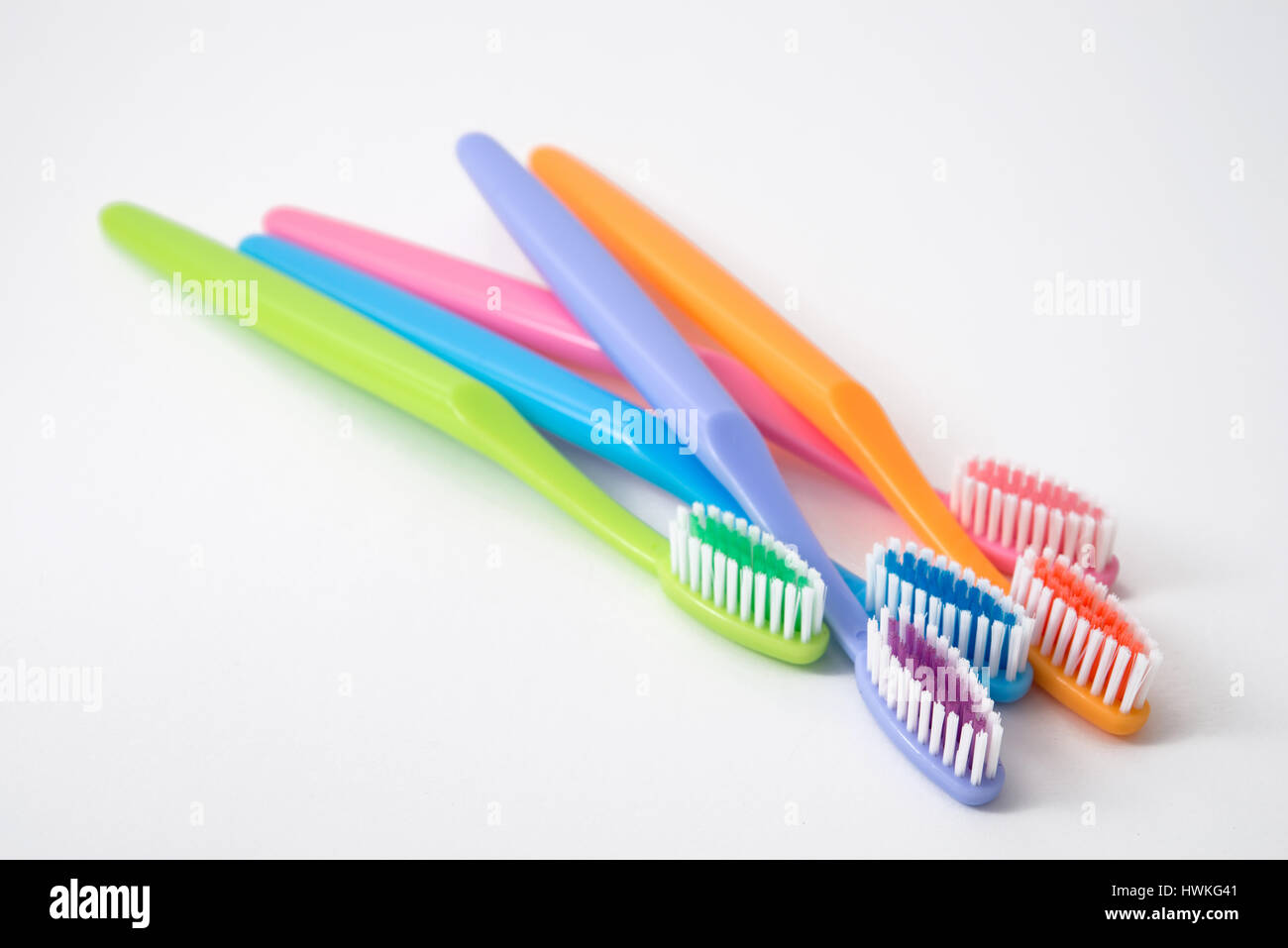 colorful toothbrushes on white background Stock Photo - Alamy