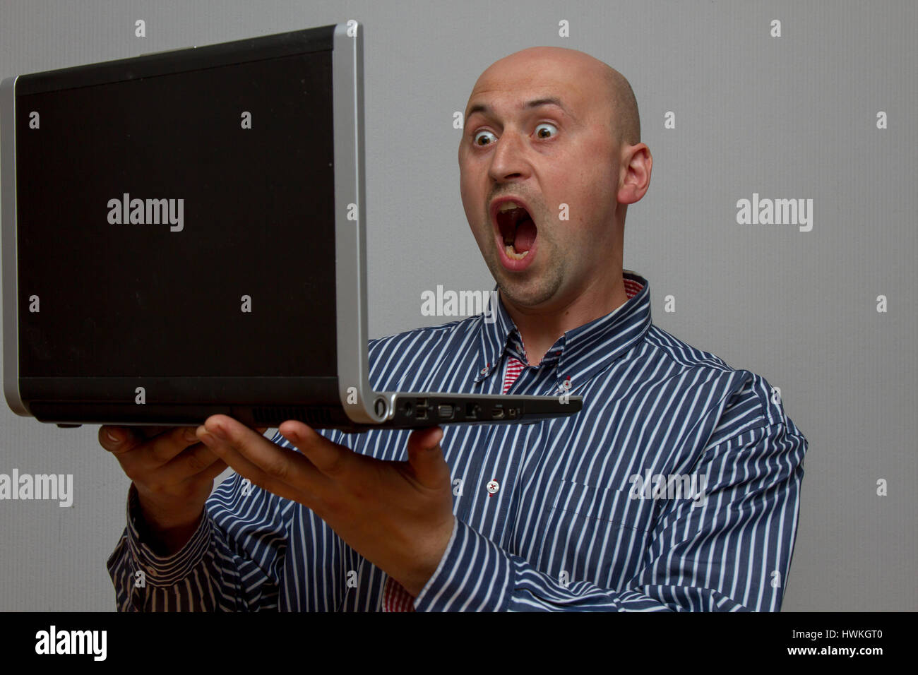Shocked Surprised Man Looking At Laptop Computer Surprised And Amazed