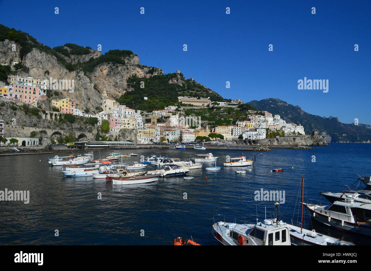 Italy's iconic pastel colored buildings lining a cove along the Amalfi ...