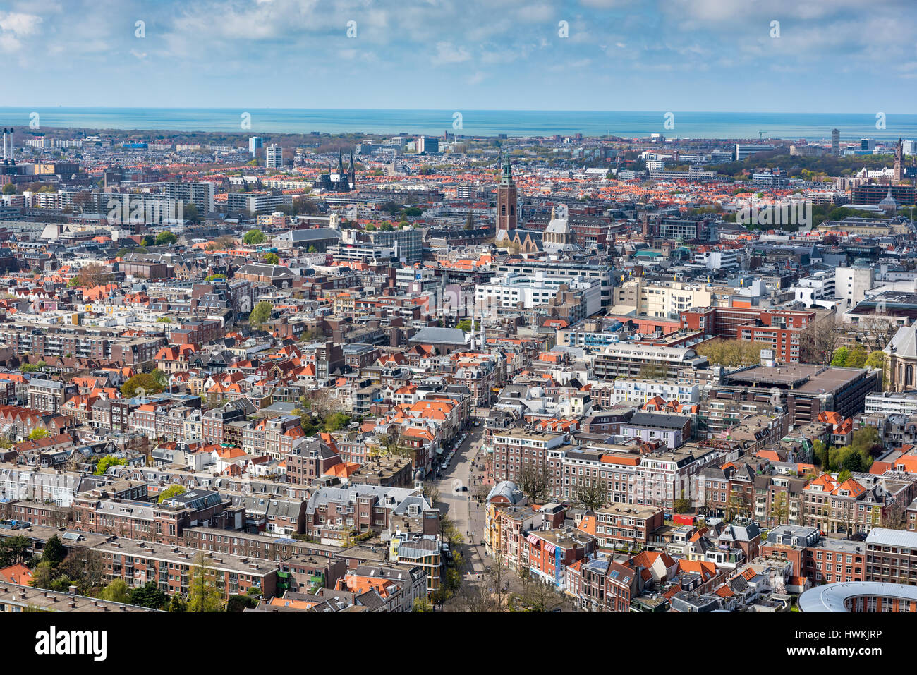 Aerial cityscape of The Hague (Den Haag) with the North Sea and cloudy ...