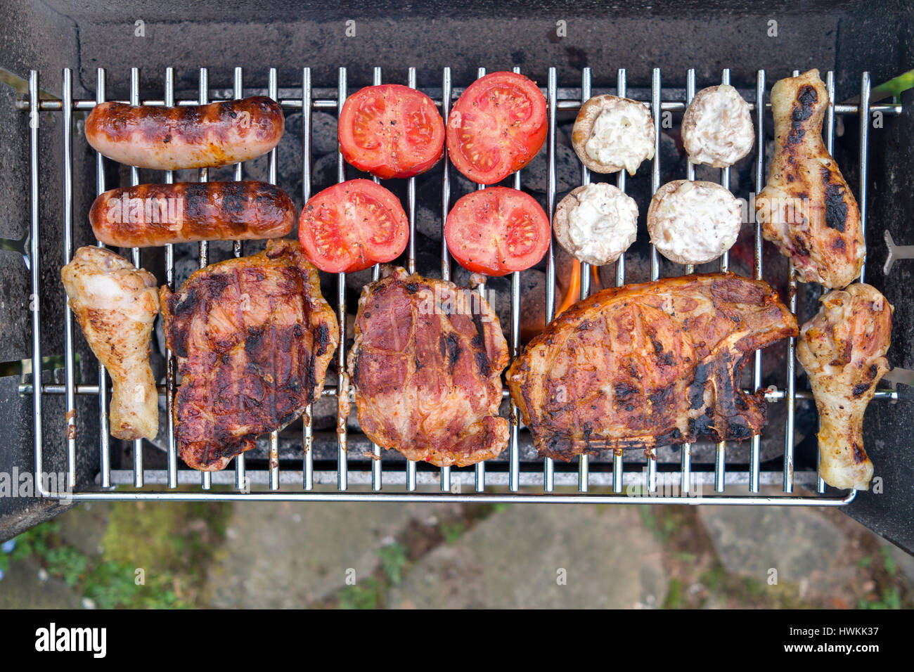 different meat and vegetables on grill with charcoal Stock Photo - Alamy
