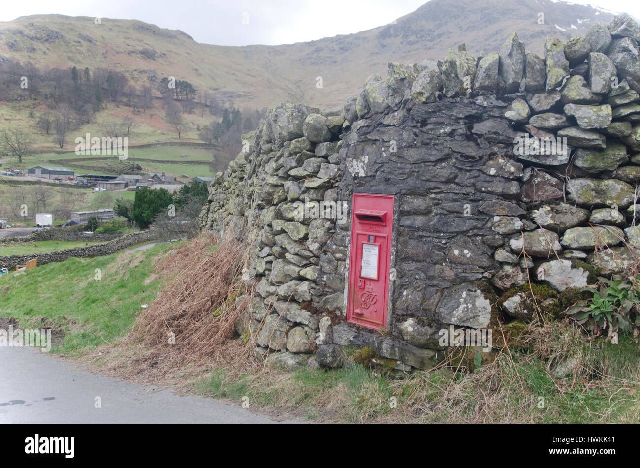Old Red Wall Mounted Royal Mail Letter Box Beside A Country Road In