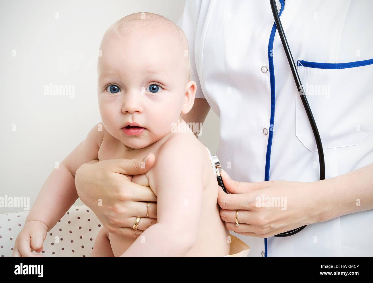Child treated by a doctor Stock Photo - Alamy