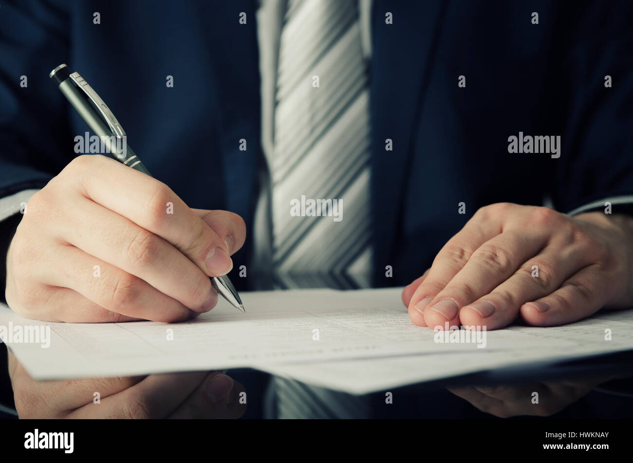 Businessman signs a contract. man contract signing hand writing pen ...