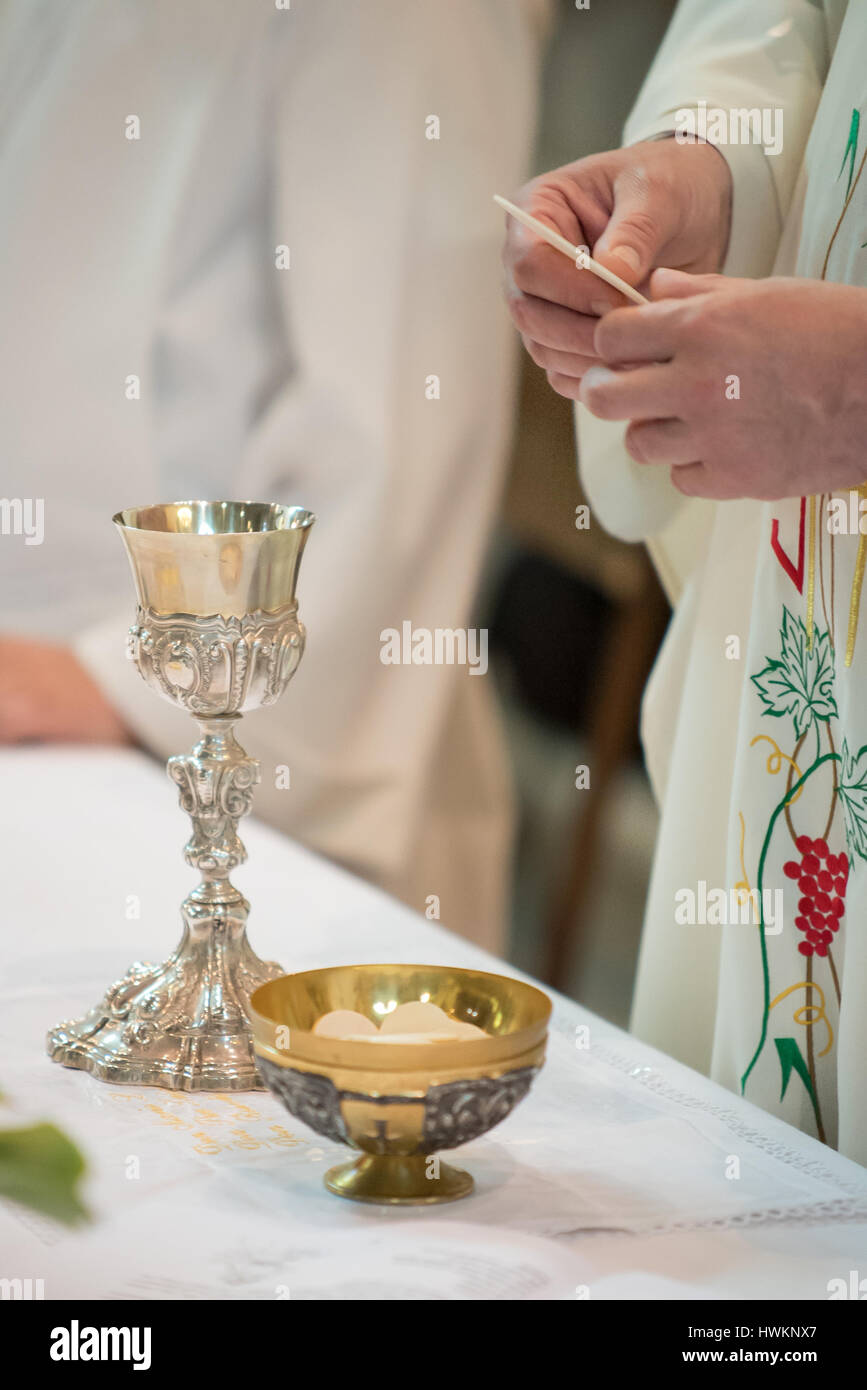 The holy bread of the communion during the mass Stock Photo - Alamy