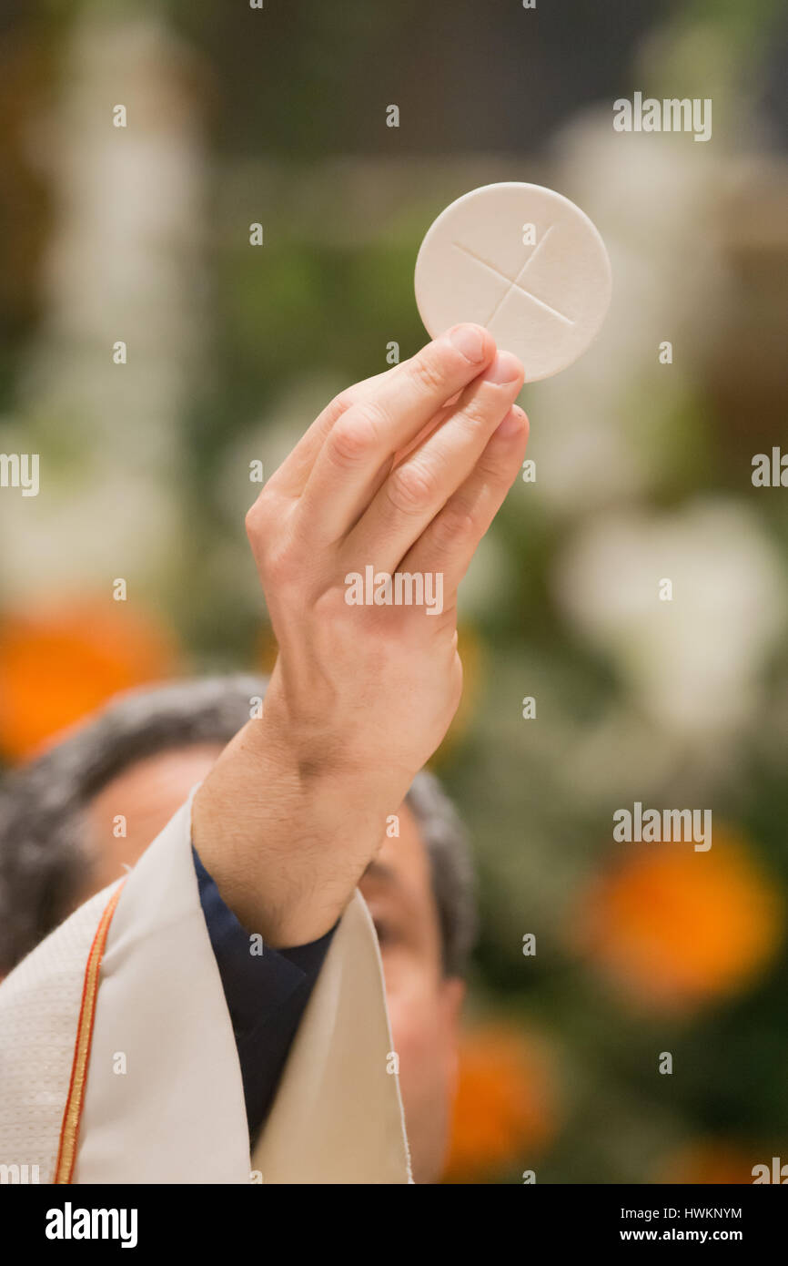 The holy bread of the Communion during the Mass Stock Photo - Alamy