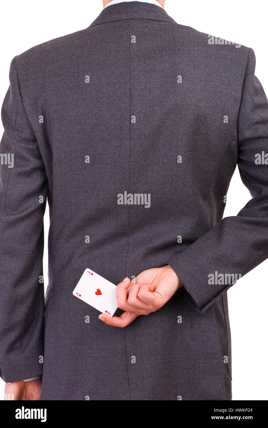 Businessman holding playing card behind his back Stock Photo - Alamy