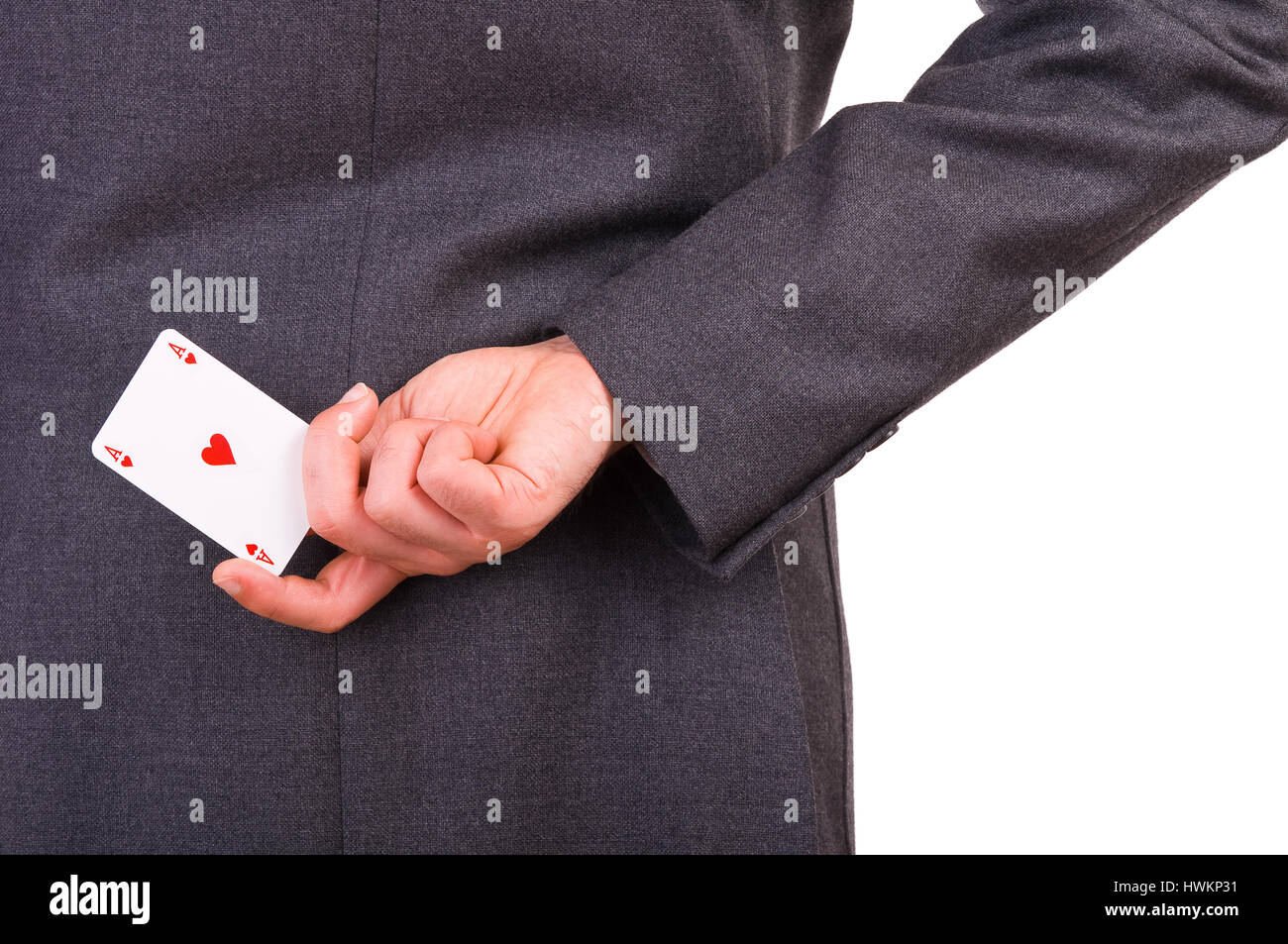 Businessman holding playing card behind his back Stock Photo - Alamy