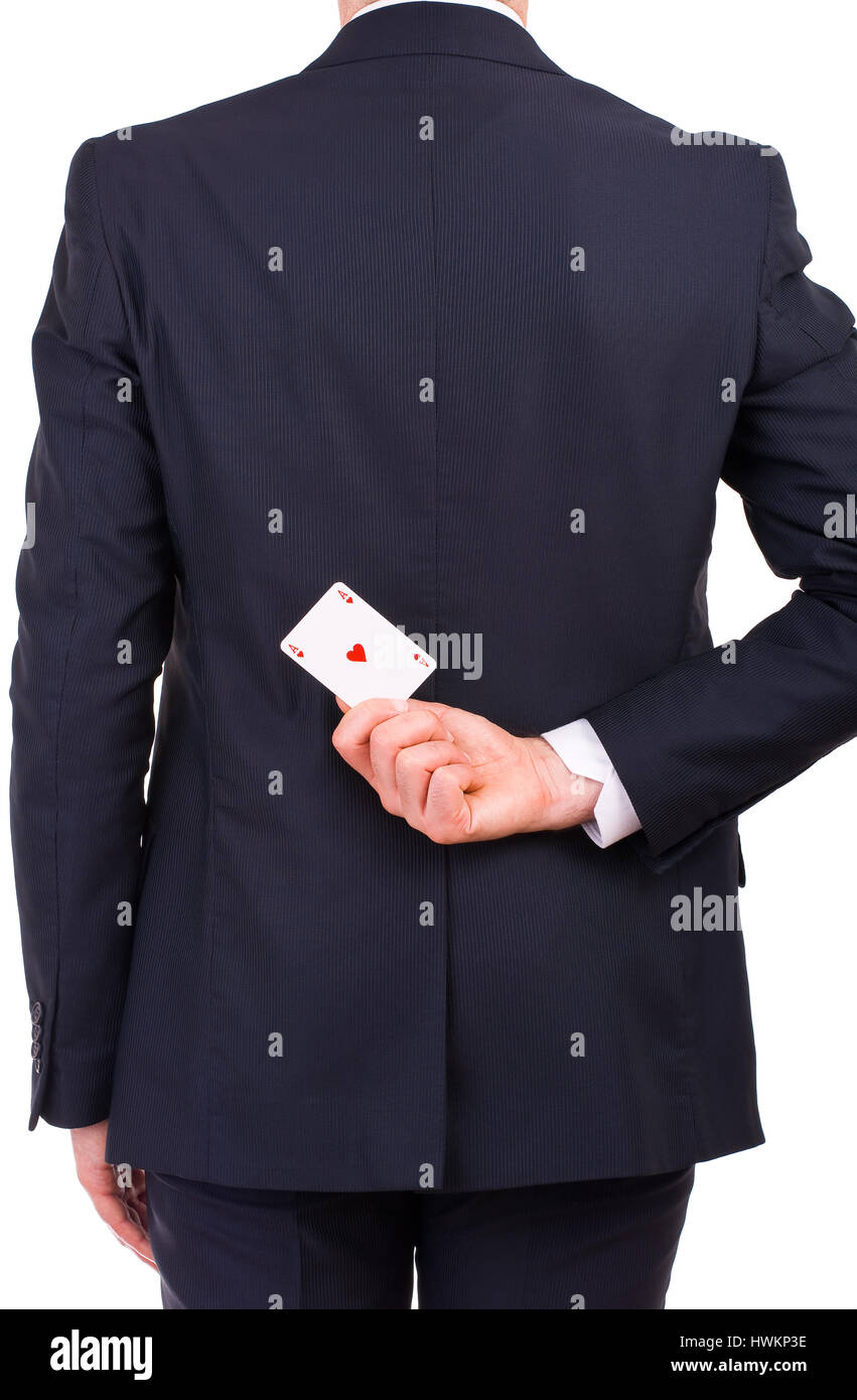 Businessman holding playing card behind his back Stock Photo - Alamy