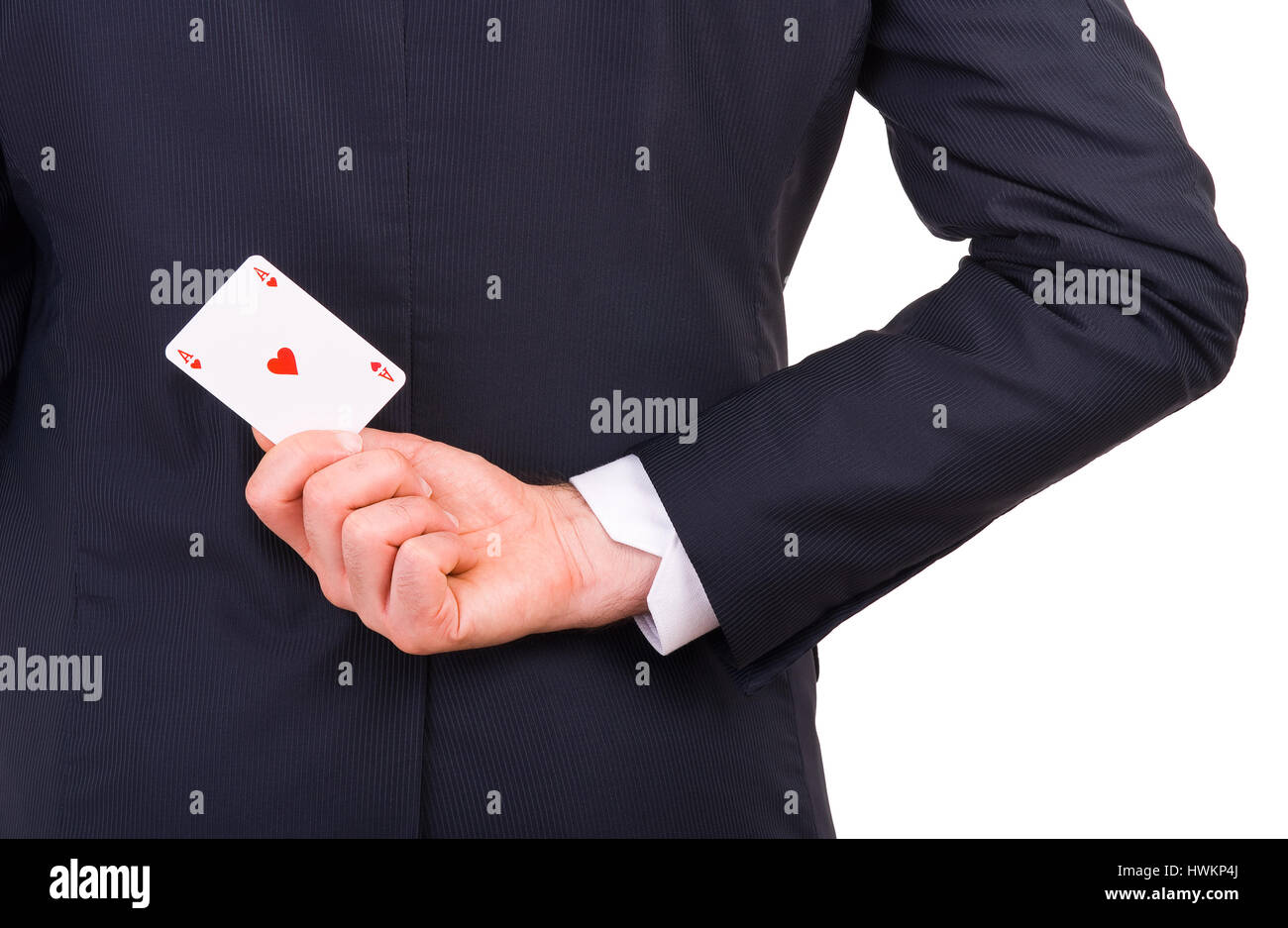 Businessman holding playing card behind his back Stock Photo - Alamy