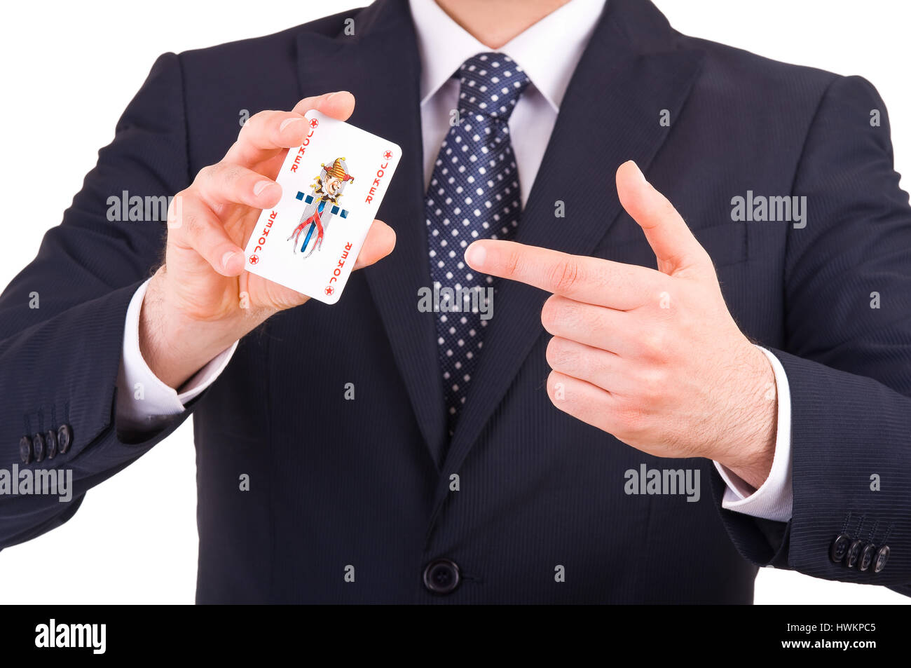 Businessman showing playing card Stock Photo - Alamy