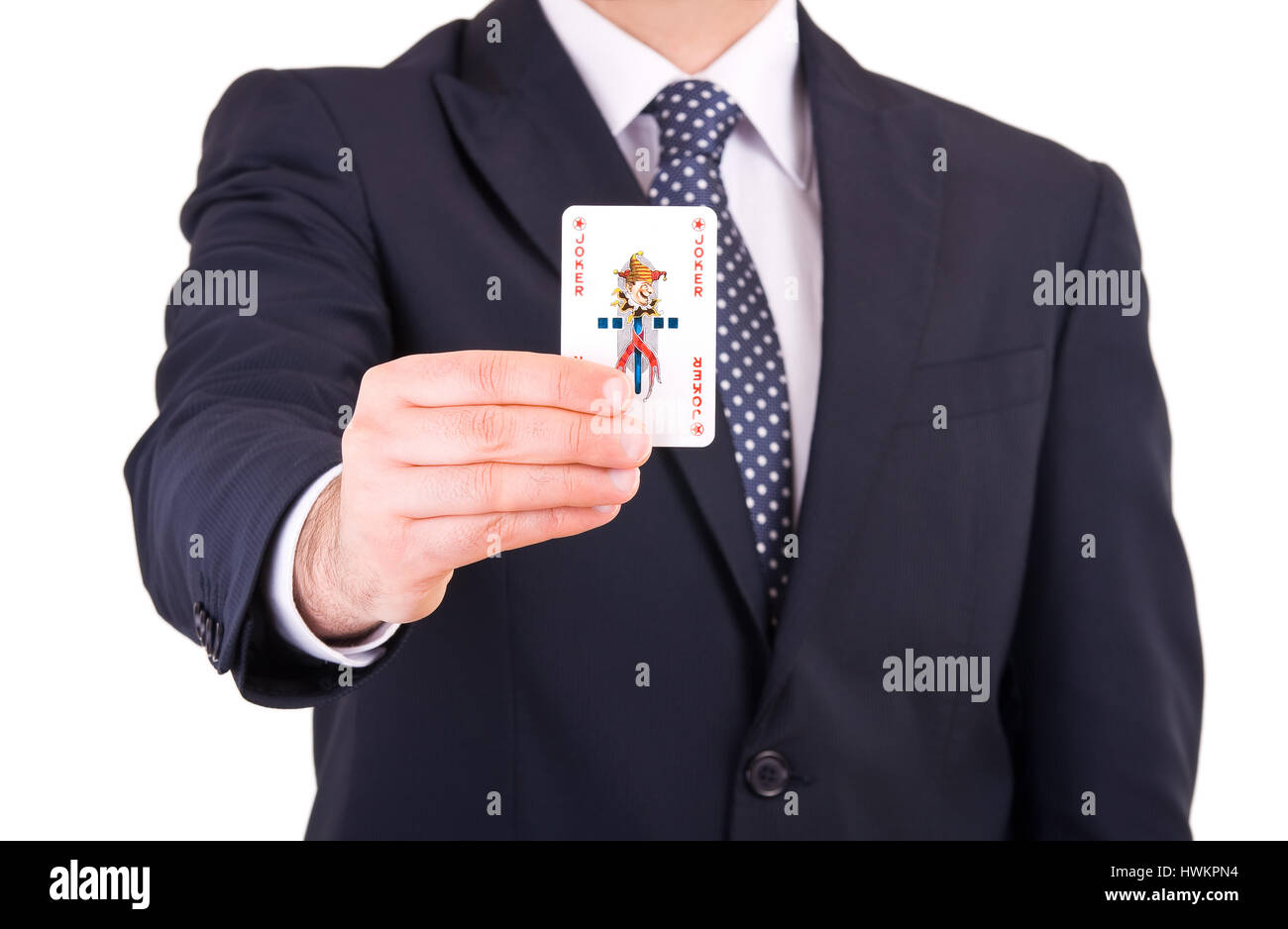 Businessman showing playing card Stock Photo - Alamy