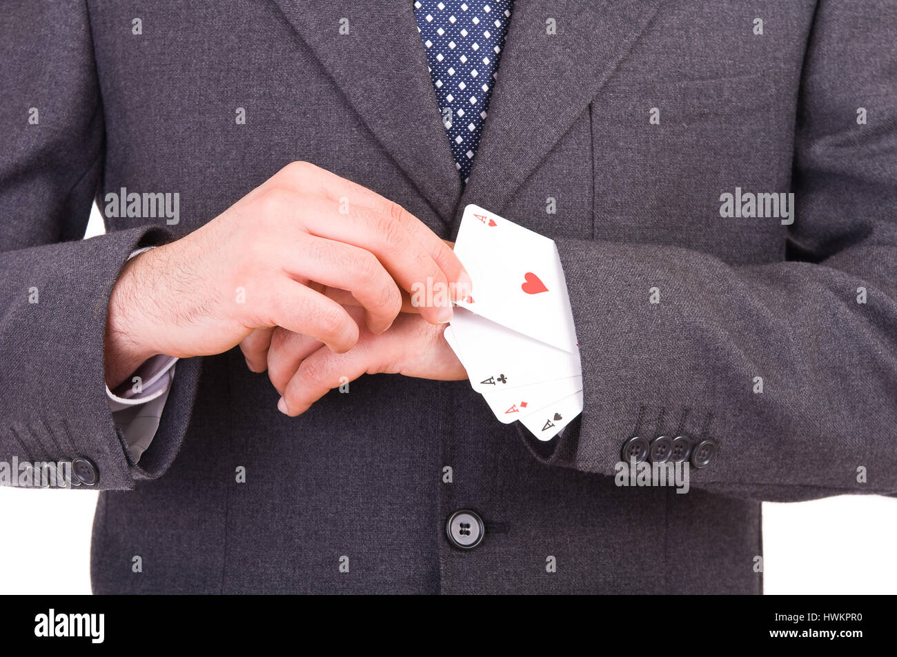 Businessman with playing cards hidden under sleeve Stock Photo - Alamy