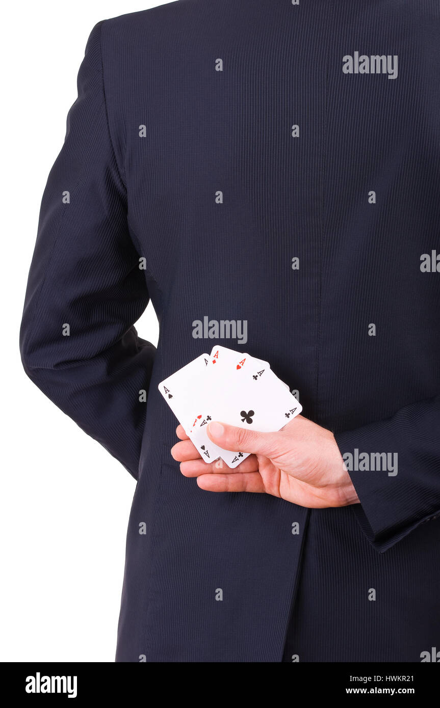 Businessman holding playing cards behind his back Stock Photo - Alamy