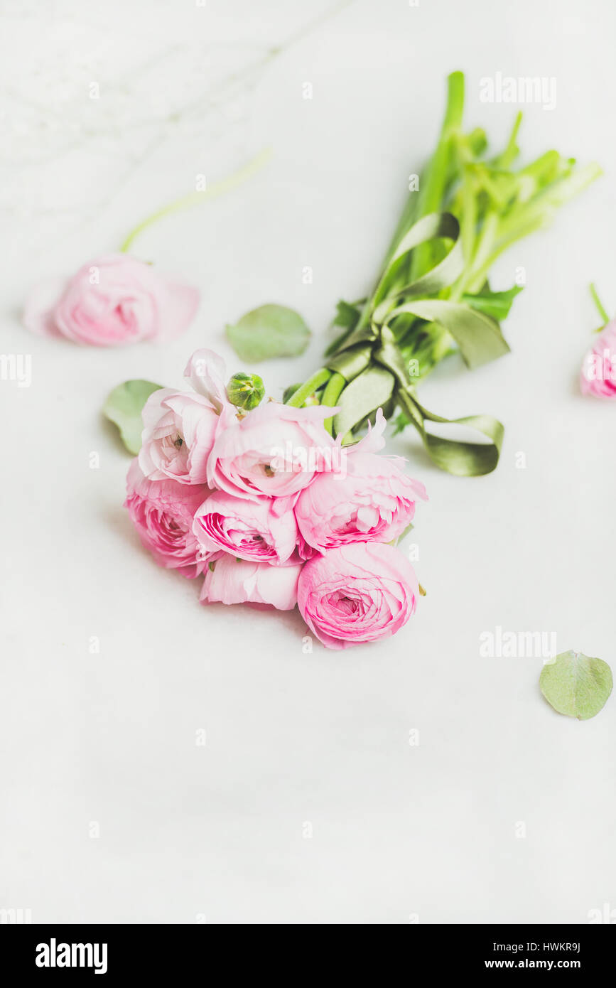 Light pink spring ranunkulus flowers on white marble background Stock ...