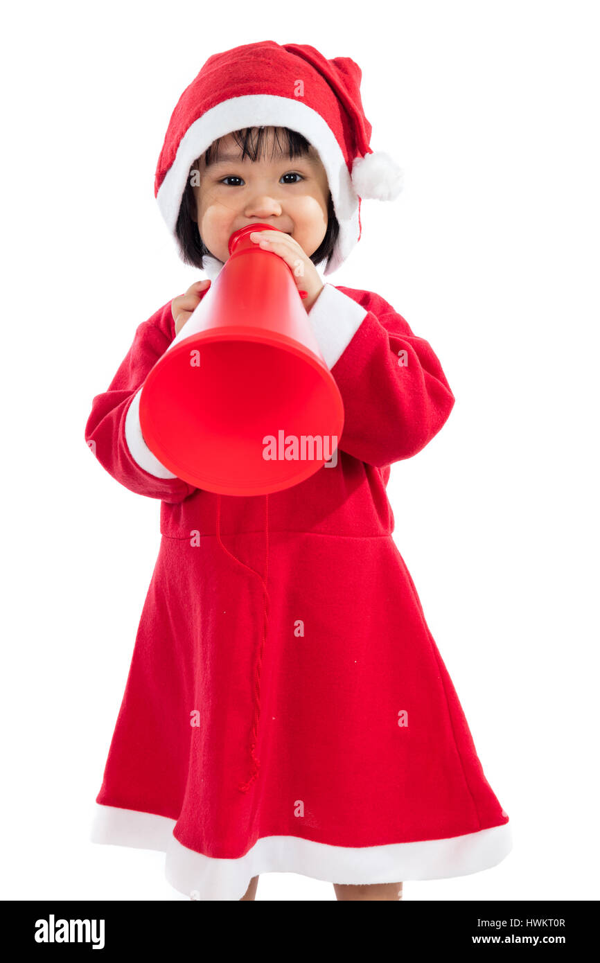 Asian Chinese little girl in santa costume holding loudspeaker in ...