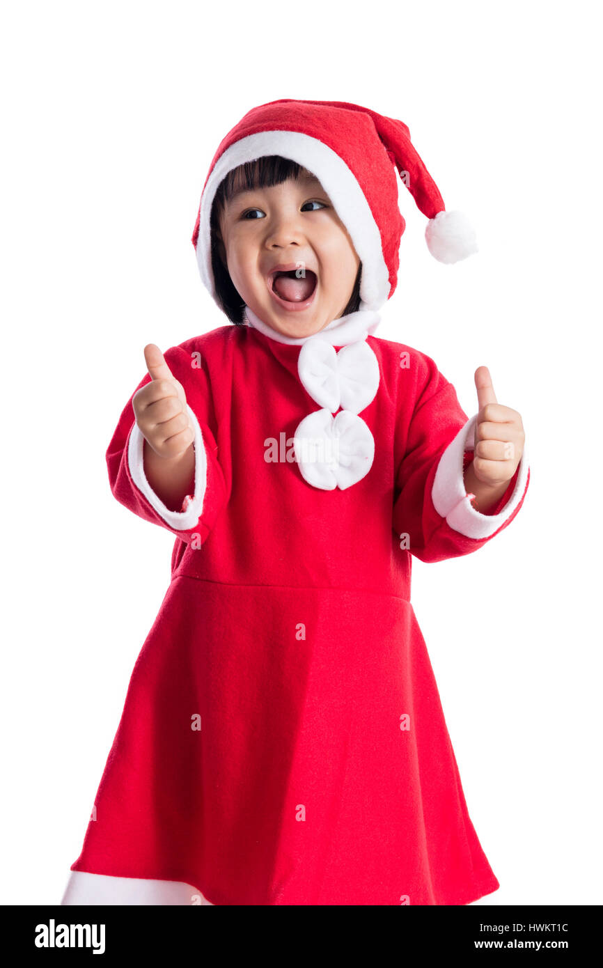 Happy Asian Chinese little santa claus girl with thumbs up in isolated ...