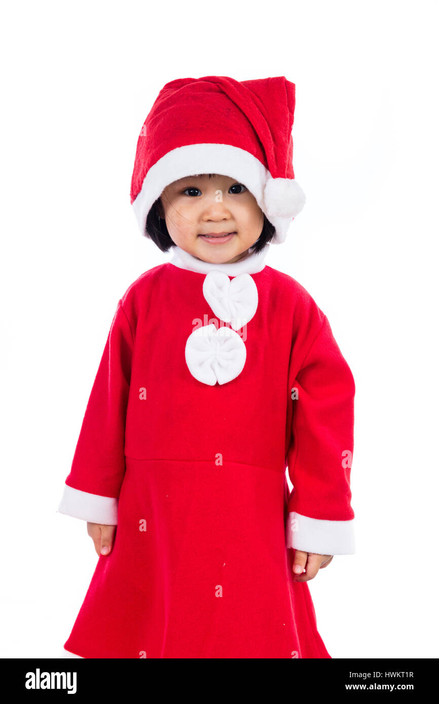 Happy Asian Chinese little girl wearing santa claus costume in isolated ...