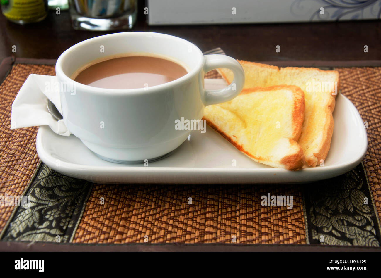 Hot coffee with toast butter with breakfast in morning time at resort ...