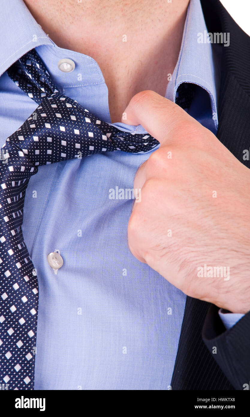 Businessman pulling his collar Stock Photo - Alamy