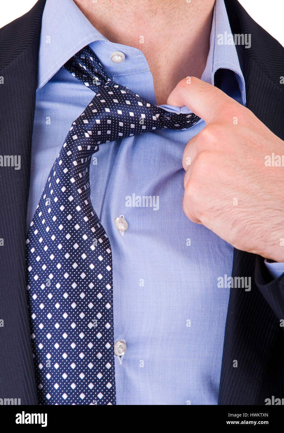 Businessman pulling his collar Stock Photo - Alamy