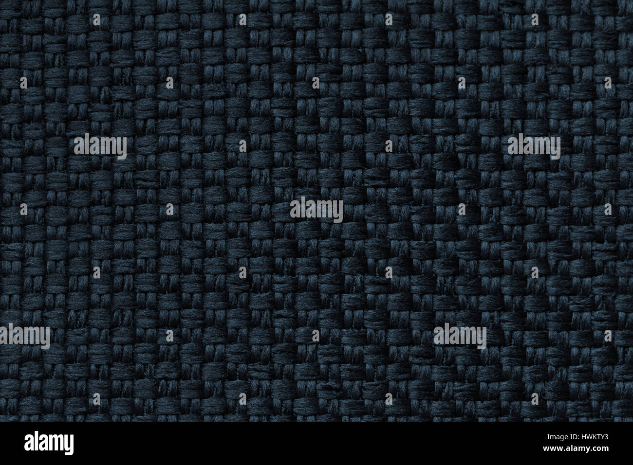 Navy blue background with checkered pattern, closeup. Structure of the ...