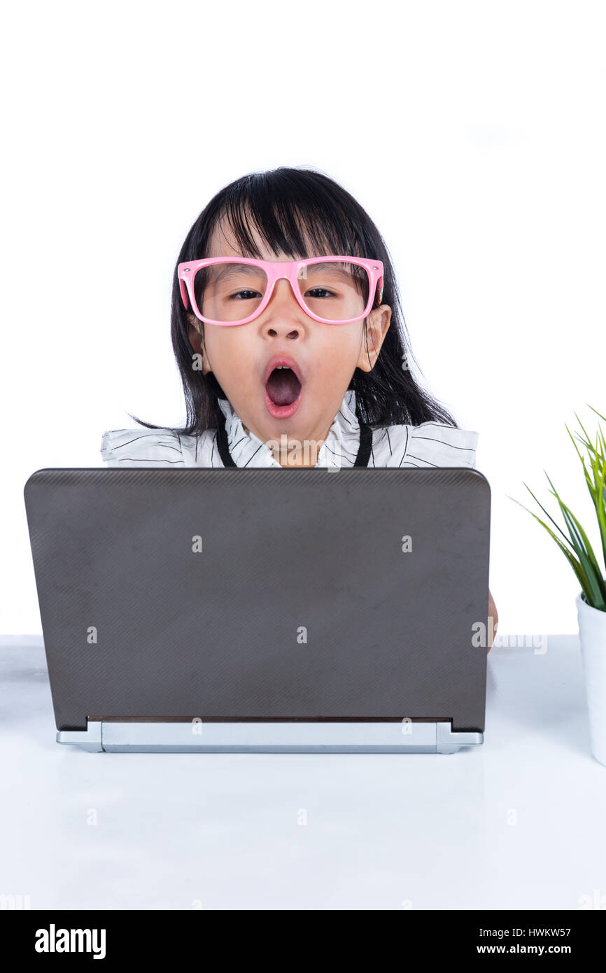Boring Asian Chinese little office lady using laptop in isolated white ...