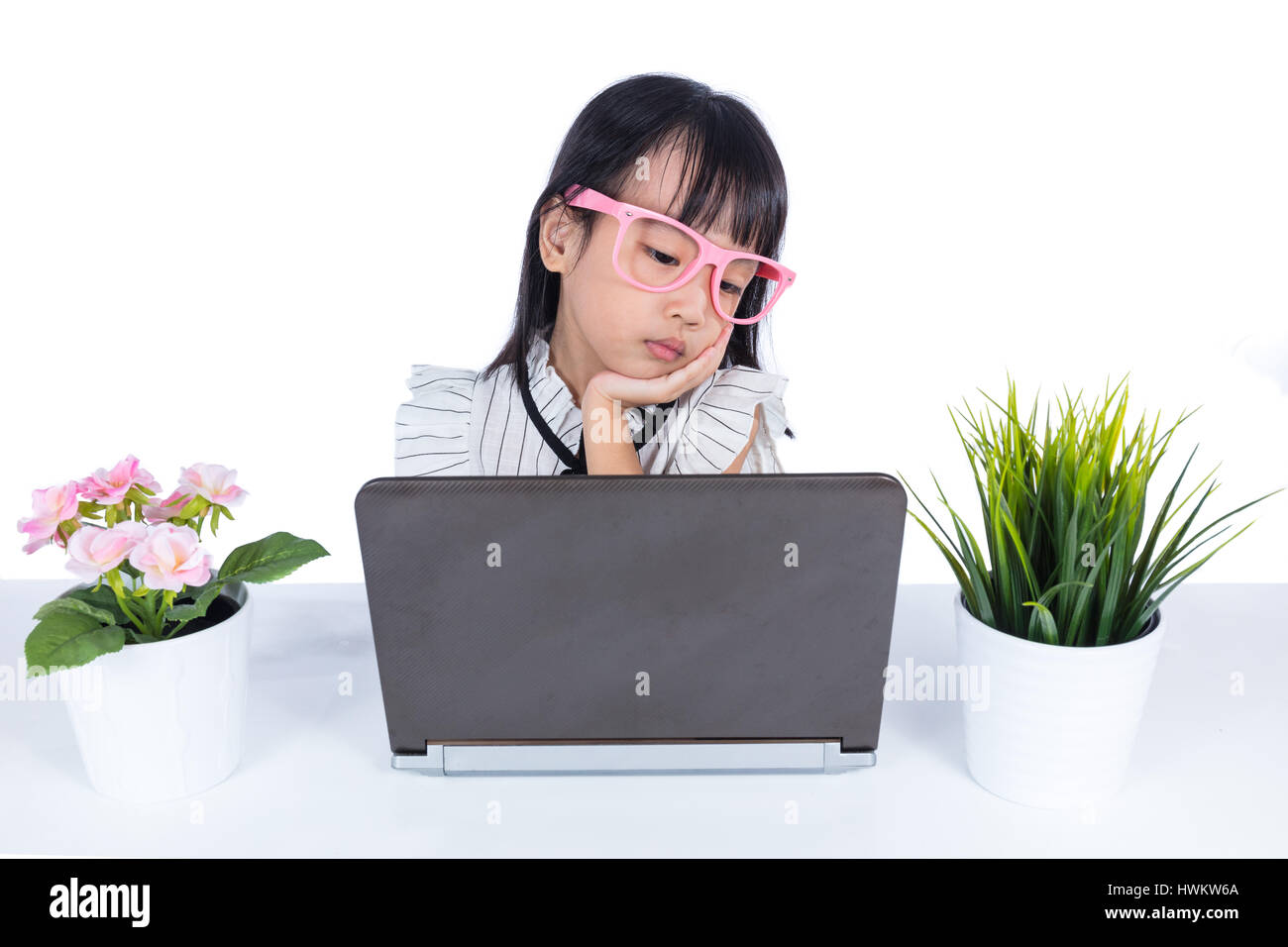 Boring Asian Chinese little office lady using laptop in isolated white ...
