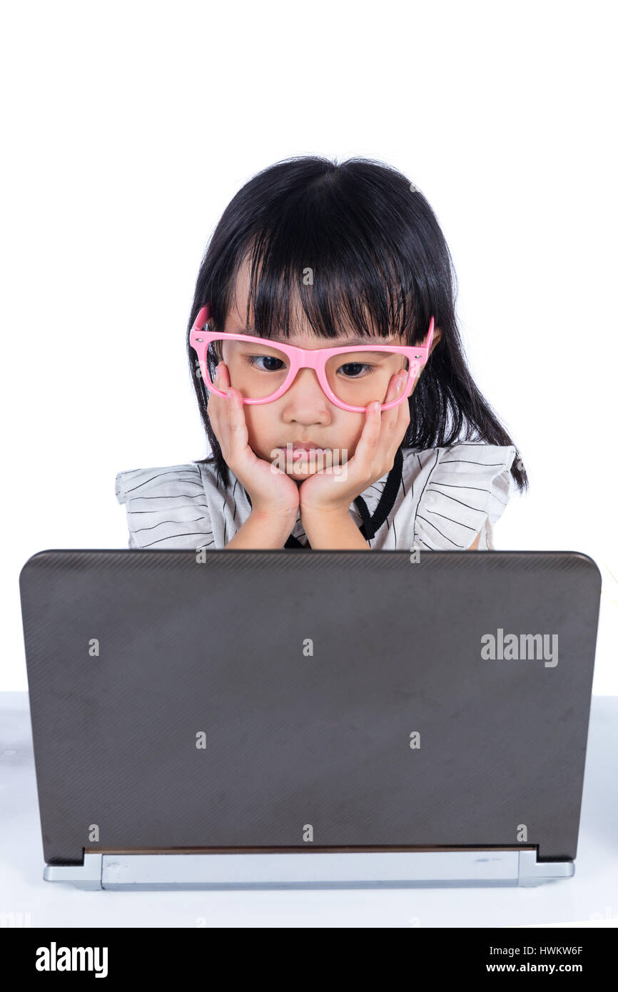 Boring Asian Chinese little office lady using laptop in isolated white ...
