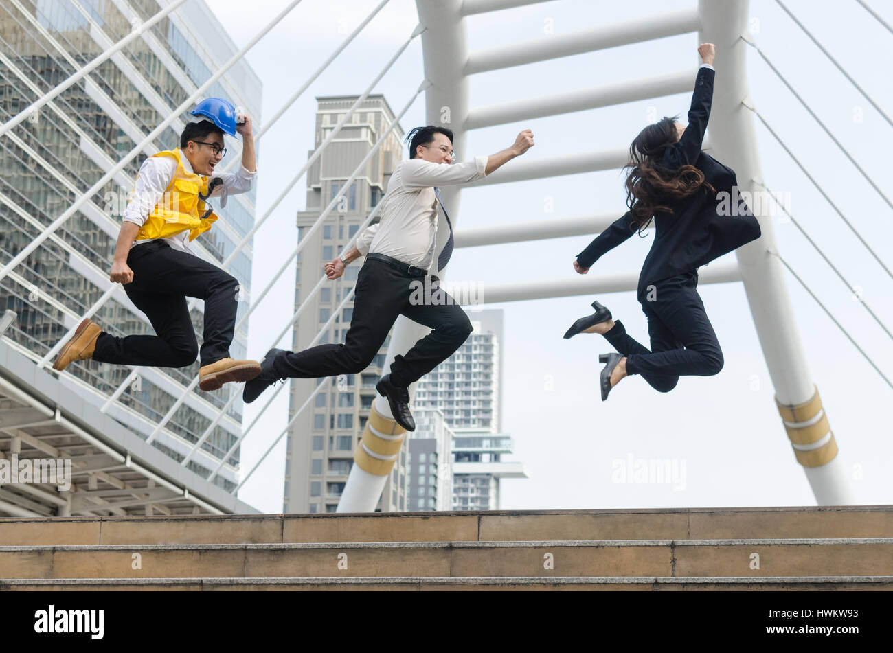 Success concept. Group of Architects team jumping with with happy ...