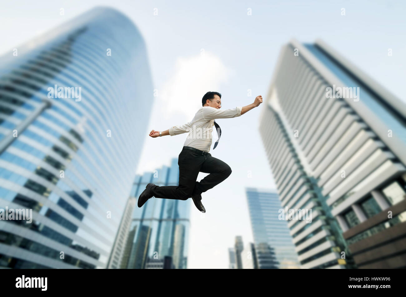 Success concept. Asian businessman jumping with with happy moment and ...