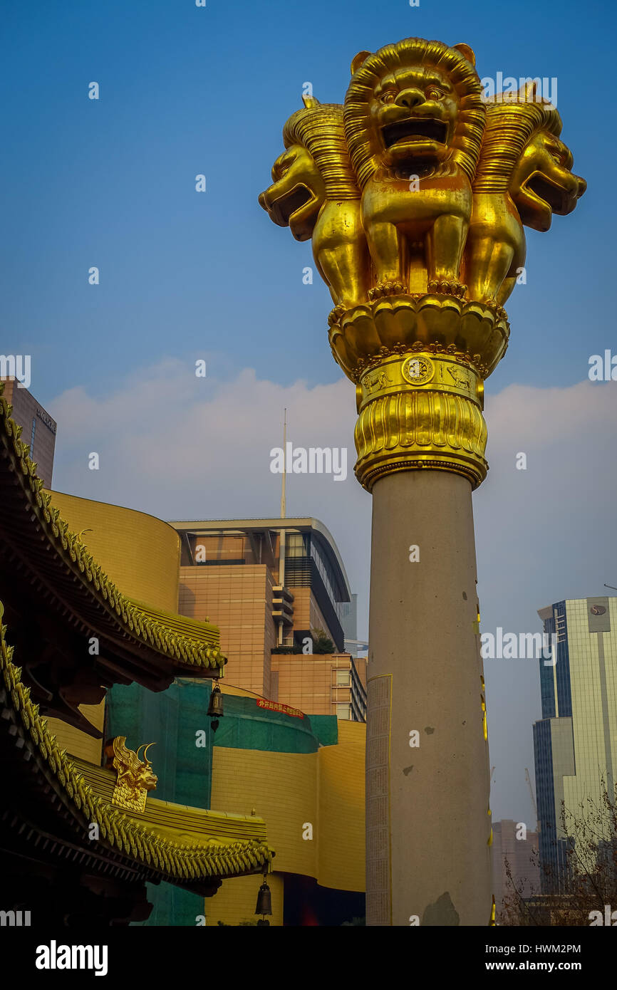 SHANGHAI, CHINA: Close up golden statue decoration sitting on top of ...